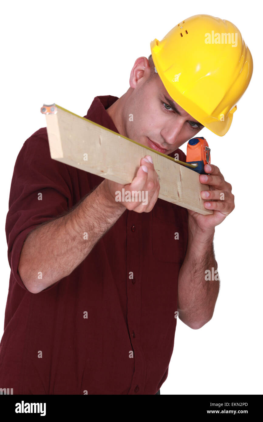 Carpenter measuring wood Stock Photo - Alamy