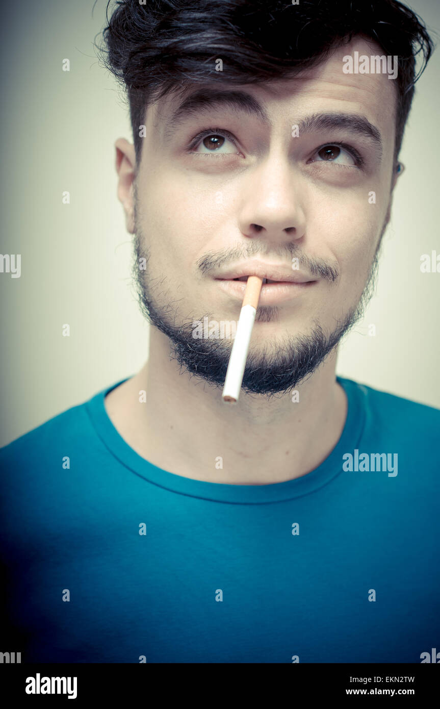 stylish young modern man with cigarette Stock Photo - Alamy