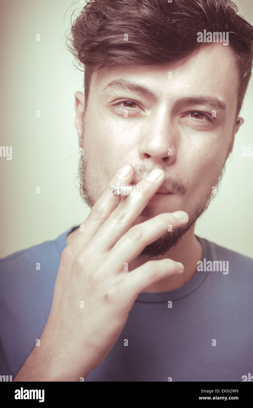 stylish young modern man with cigarette Stock Photo - Alamy