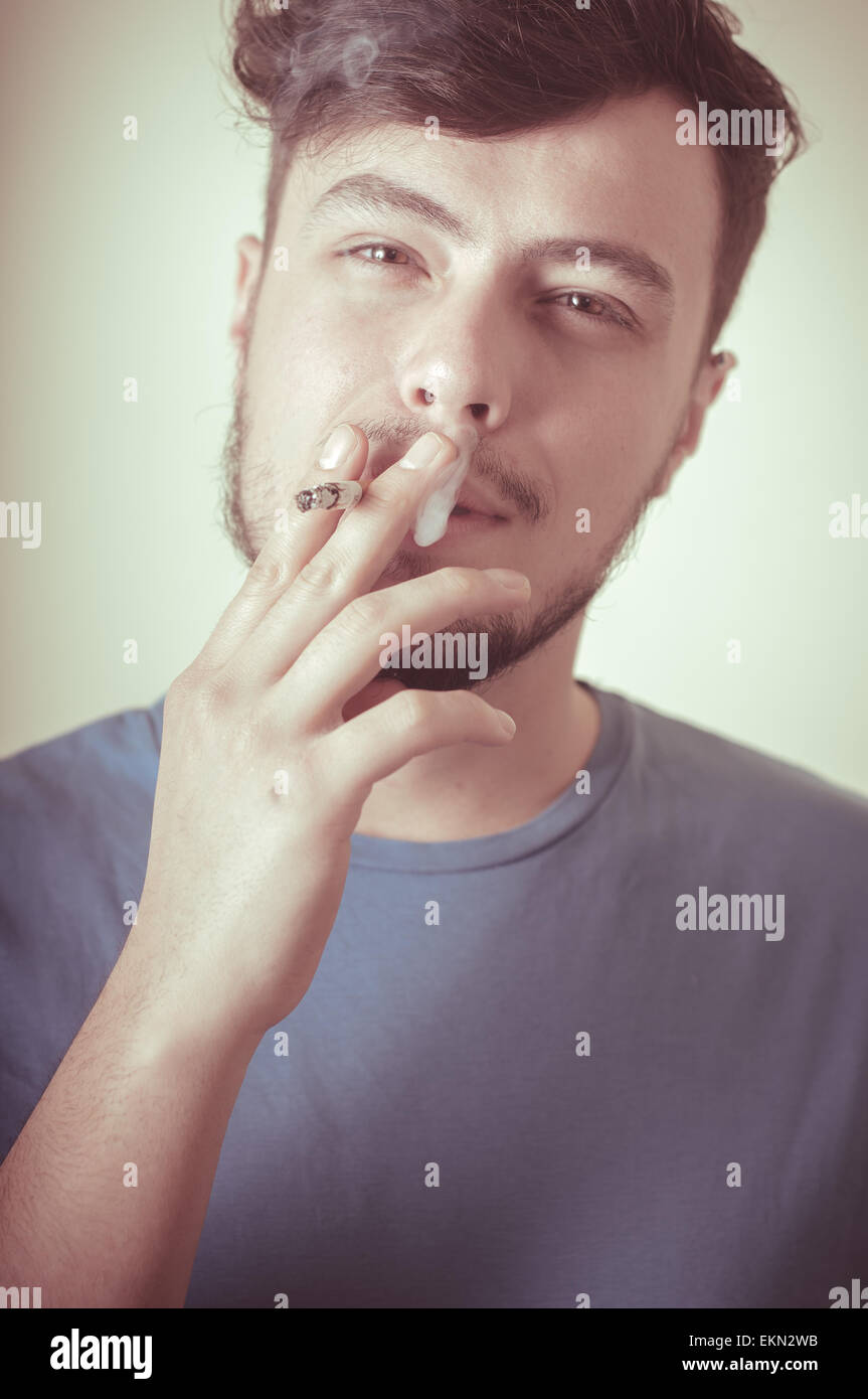 stylish young modern man with cigarette Stock Photo - Alamy