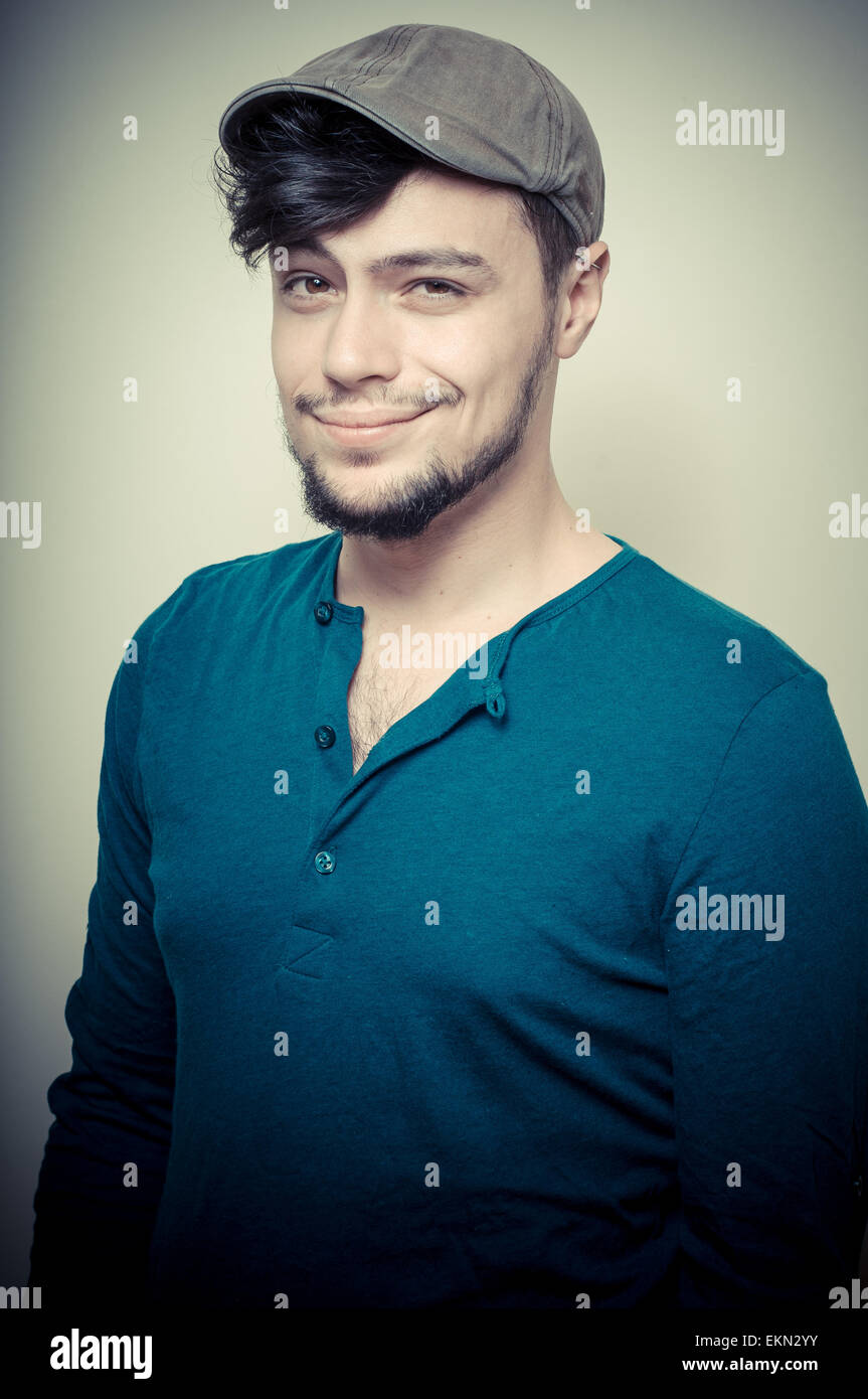 young modern stylish man with cap Stock Photo - Alamy