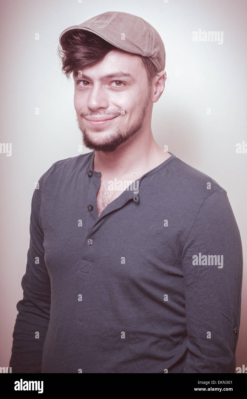 young modern stylish man with cap Stock Photo - Alamy