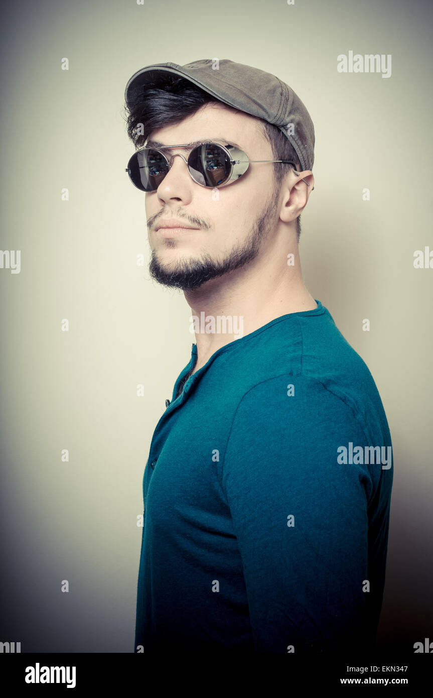 young modern stylish man with cap Stock Photo - Alamy