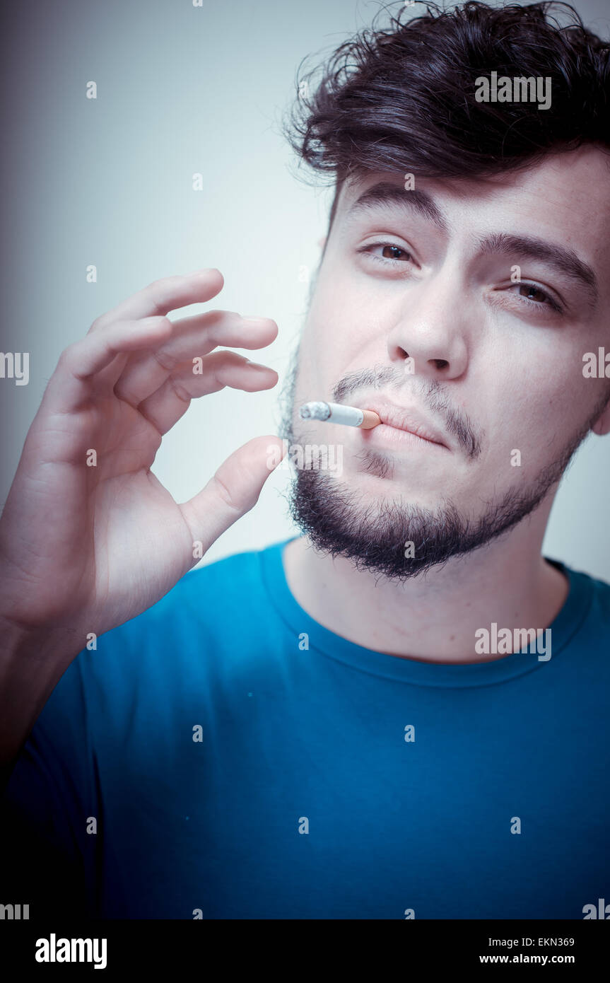 stylish young modern man with cigarette Stock Photo - Alamy