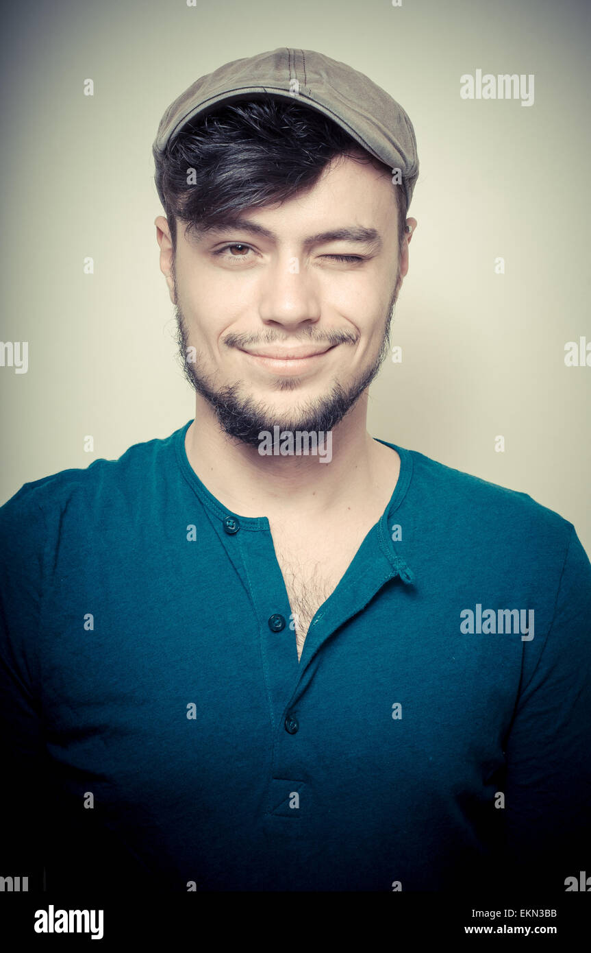 young modern stylish man with cap Stock Photo - Alamy