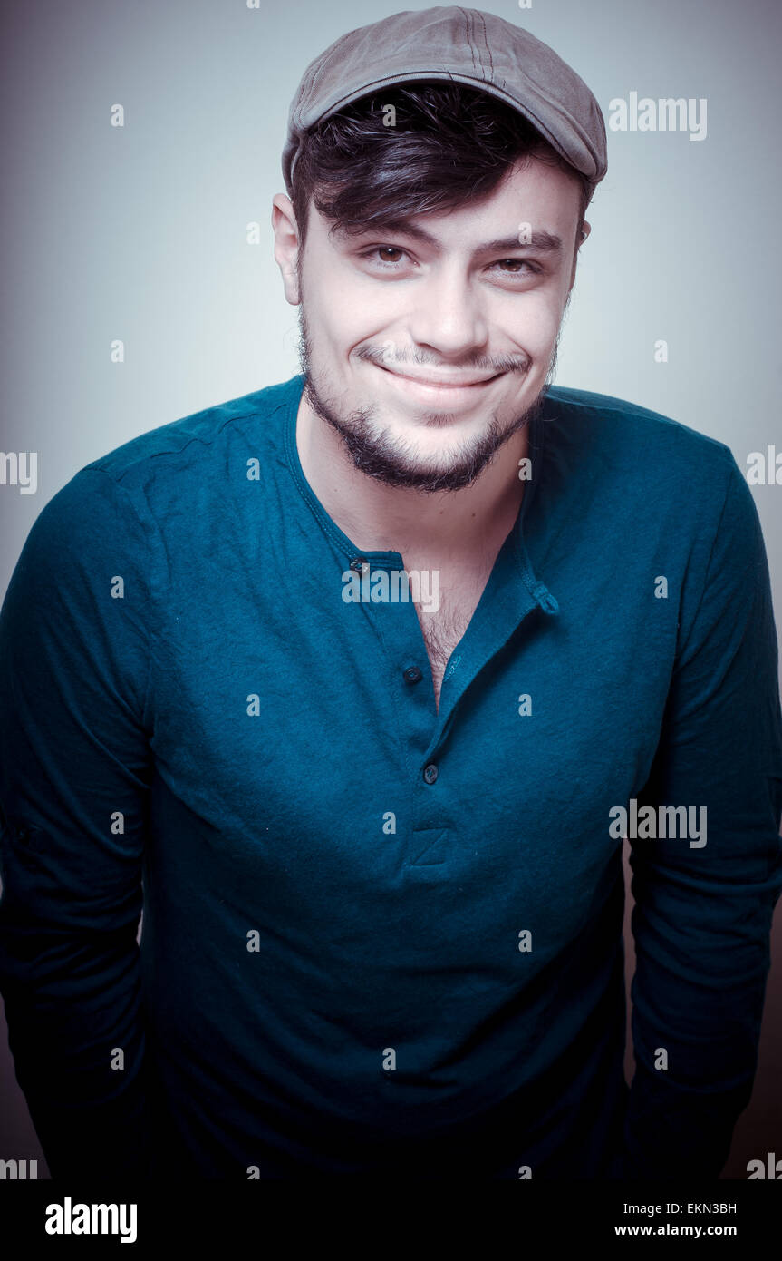 young modern stylish man with cap Stock Photo - Alamy