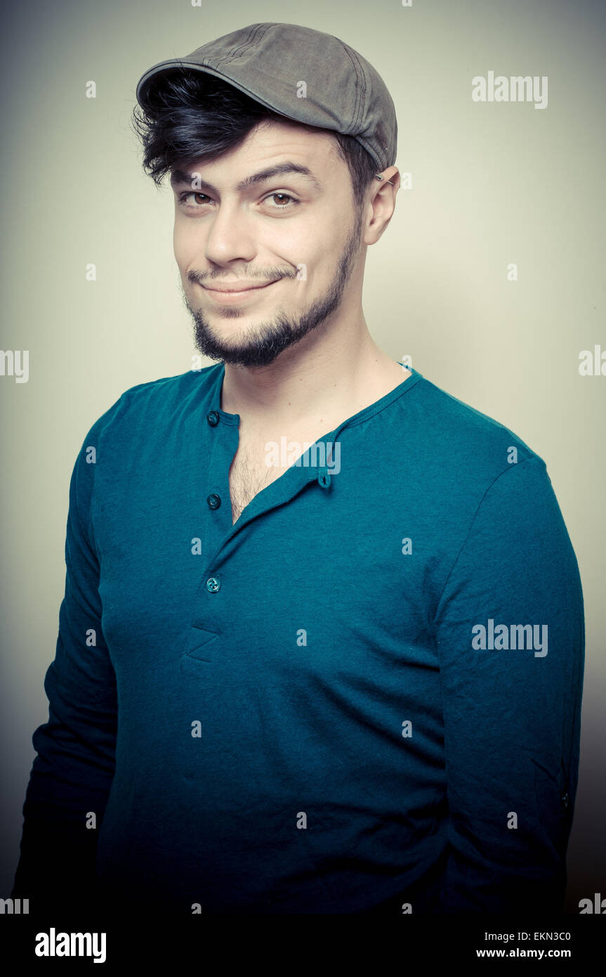 young modern stylish man with cap Stock Photo - Alamy