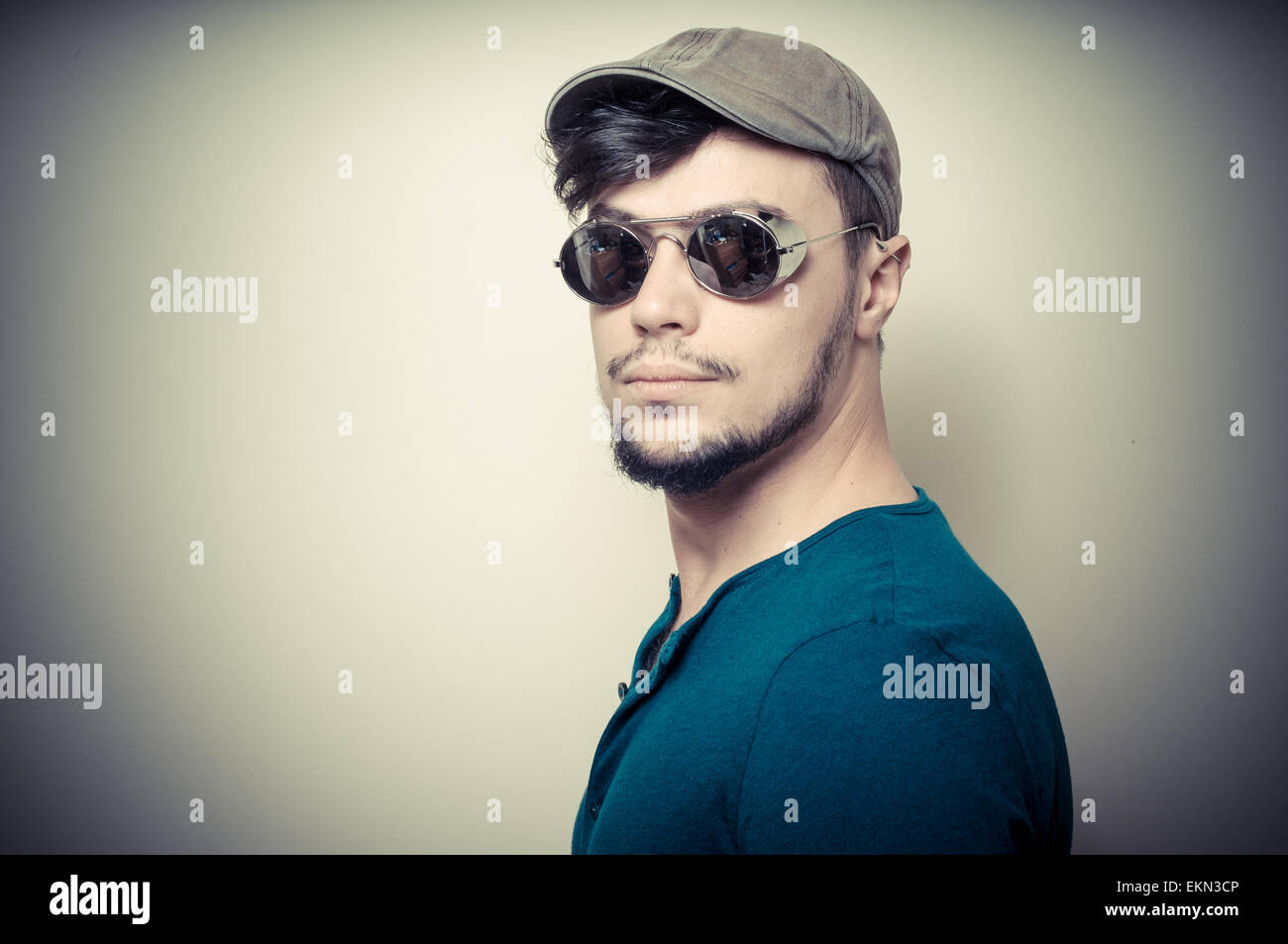 young modern stylish man with cap Stock Photo - Alamy