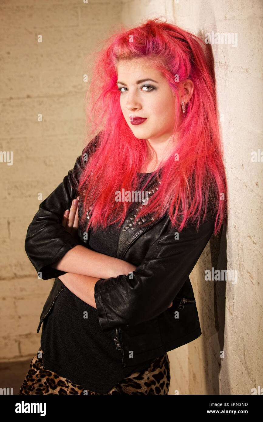 Punk Female Leaning Against Wall Stock Photo - Alamy