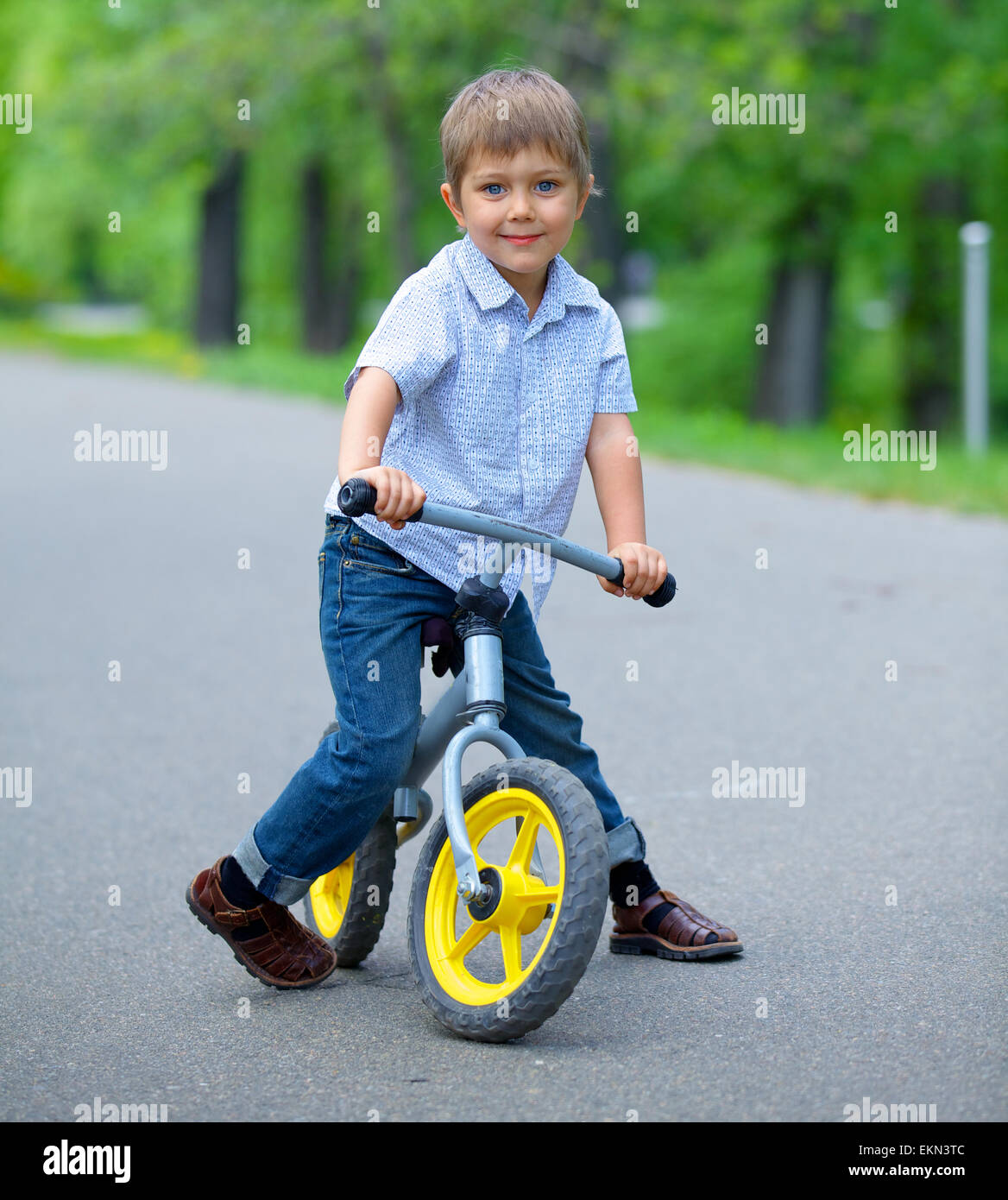 Little boy on a bicycle Stock Photo - Alamy