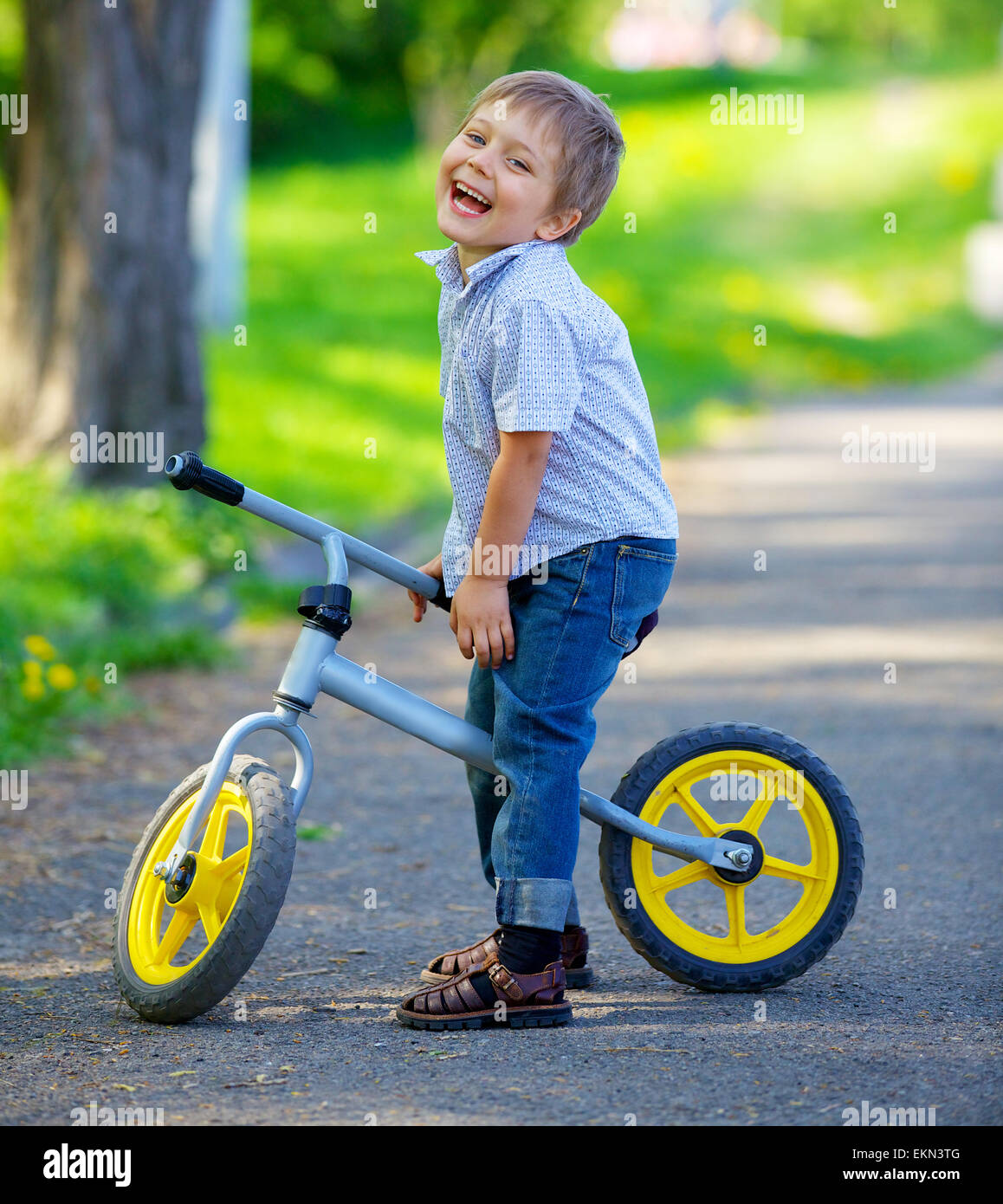 Little boy on a bicycle Stock Photo - Alamy