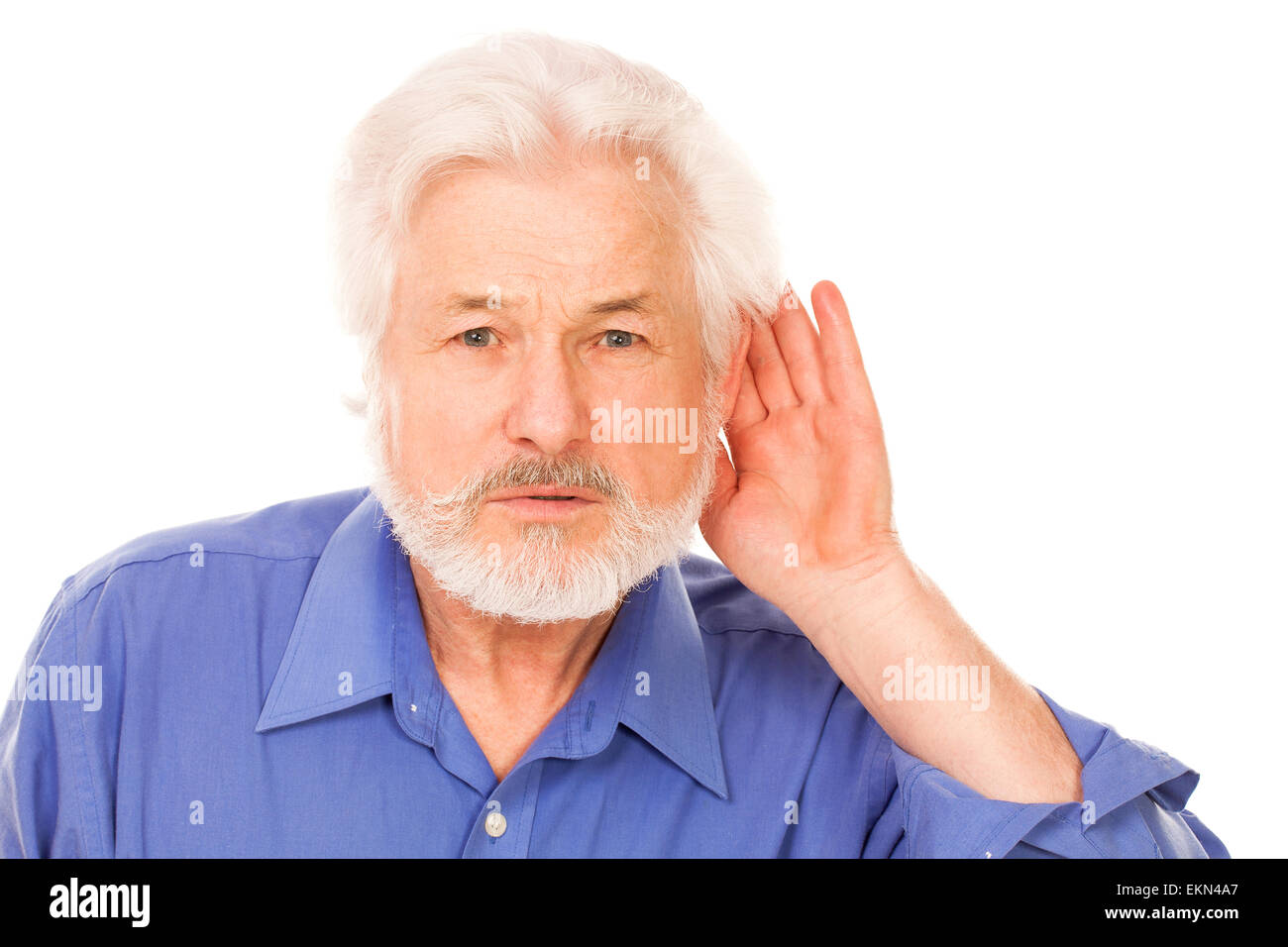 Elderly man holds hand on ear Stock Photo - Alamy