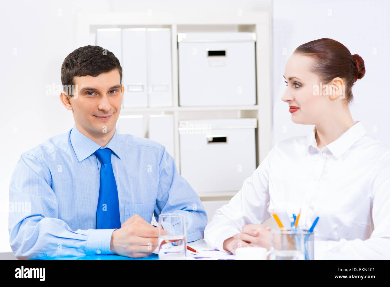 Successful attractive female boss discussing hi-res stock photography ...
