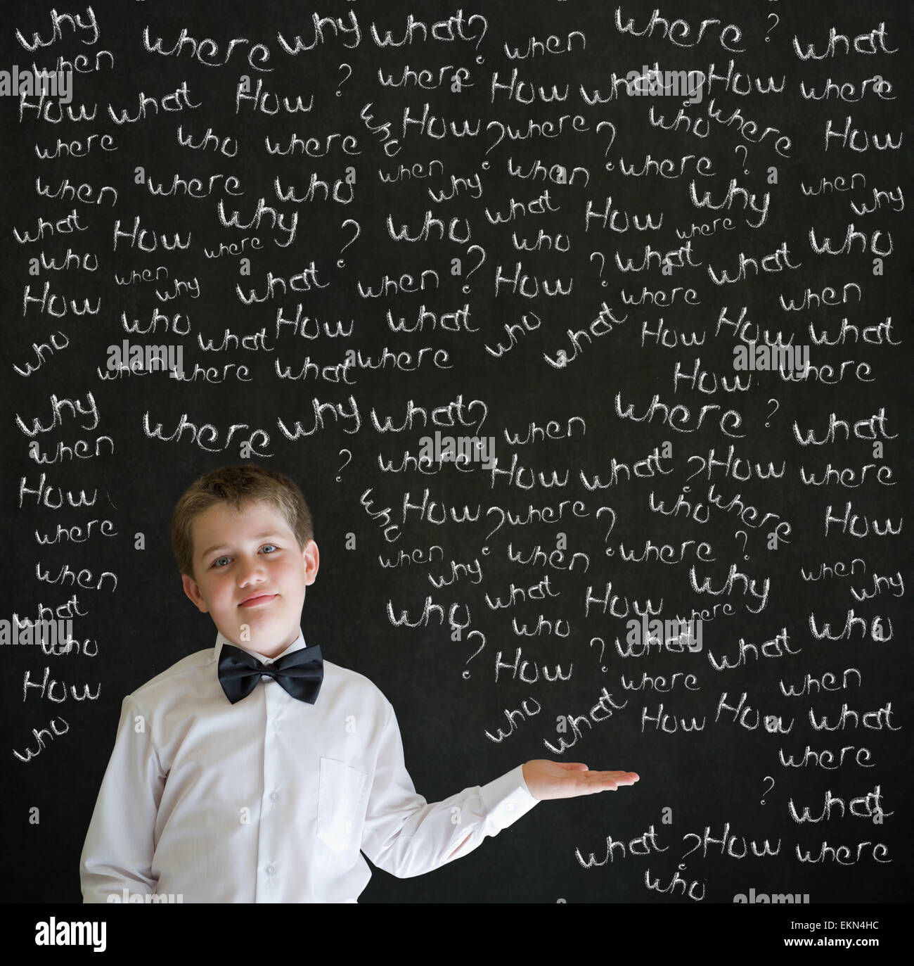 Hand up answer boy dressed up as business man with chalk questions ...