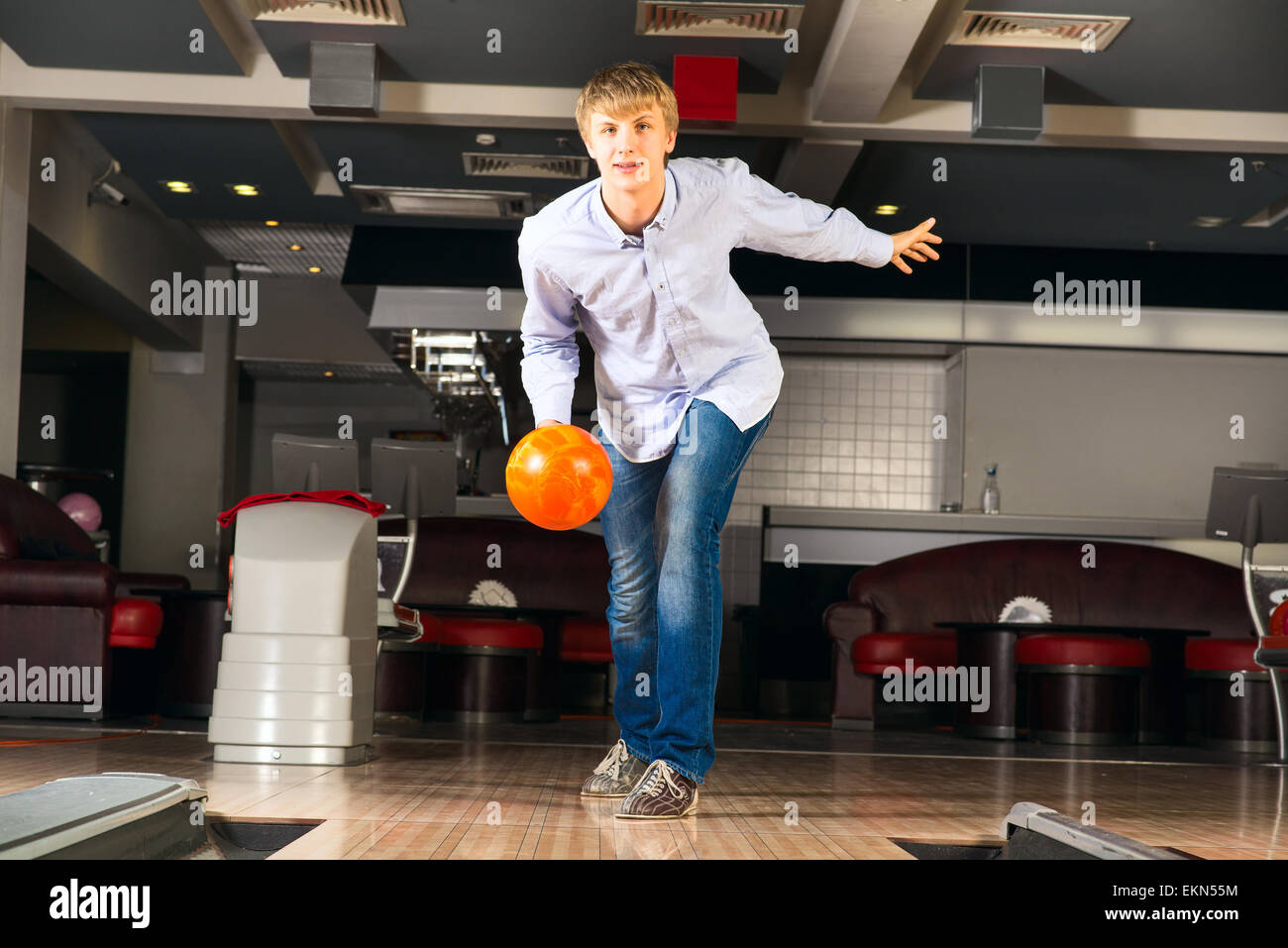 young man playing bowling Stock Photo - Alamy