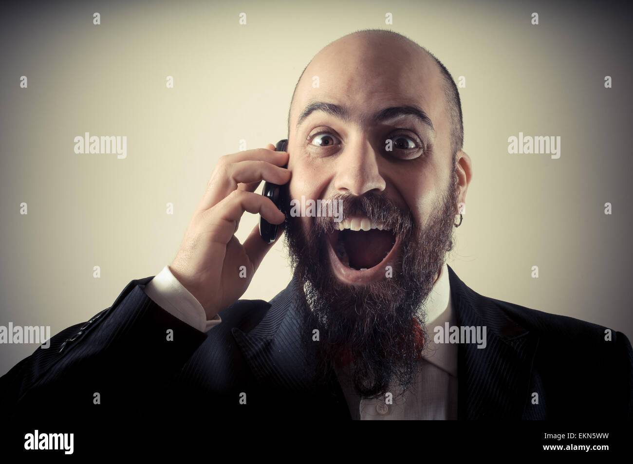 Funny happy elegant bearded man on the phone Stock Photo - Alamy