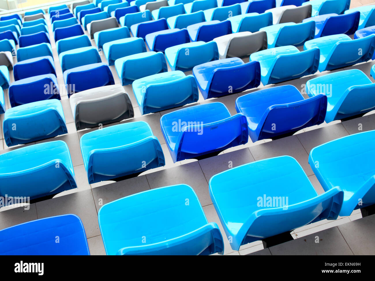 Blue seats at stadium Stock Photo - Alamy