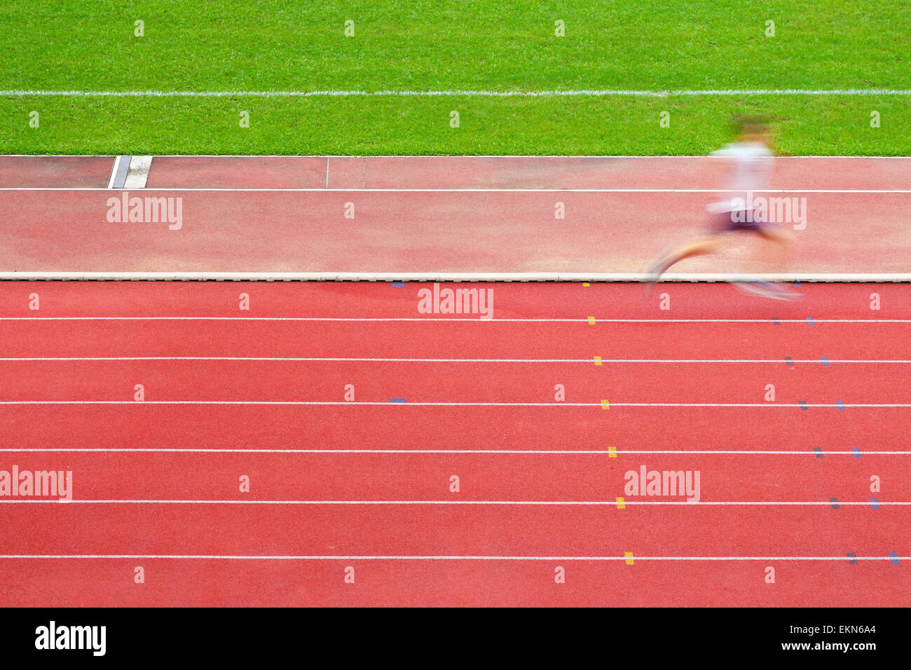 Runner in race track Stock Photo - Alamy