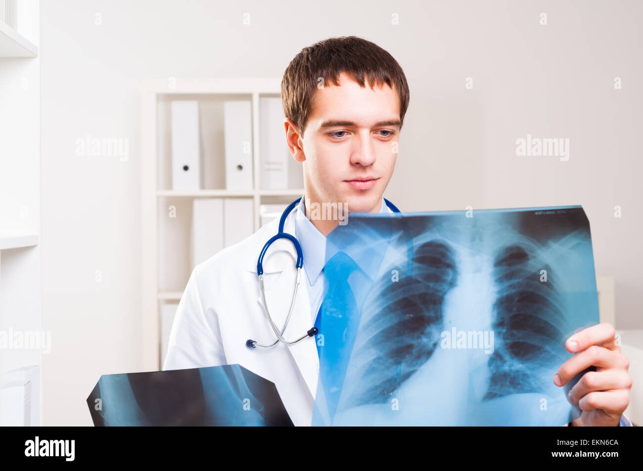 Doctor looking the x-ray Stock Photo - Alamy