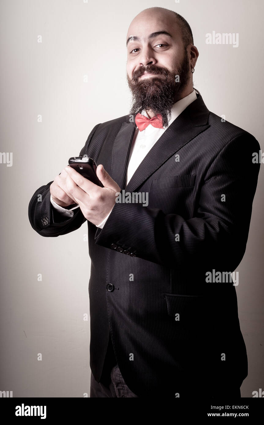Funny elegant bearded man on the phone Stock Photo - Alamy