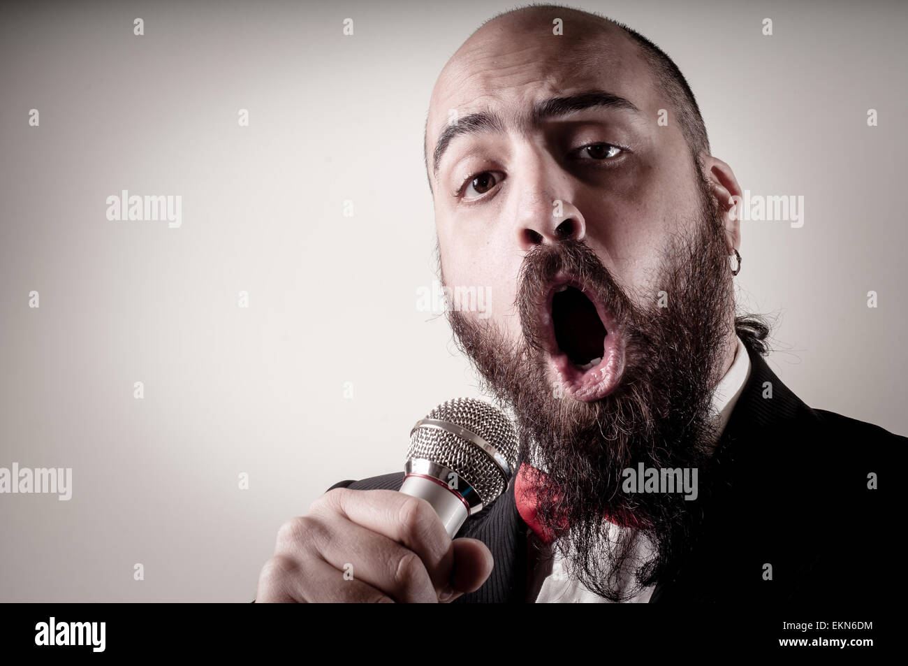 Funny elegant singer bearded Stock Photo - Alamy