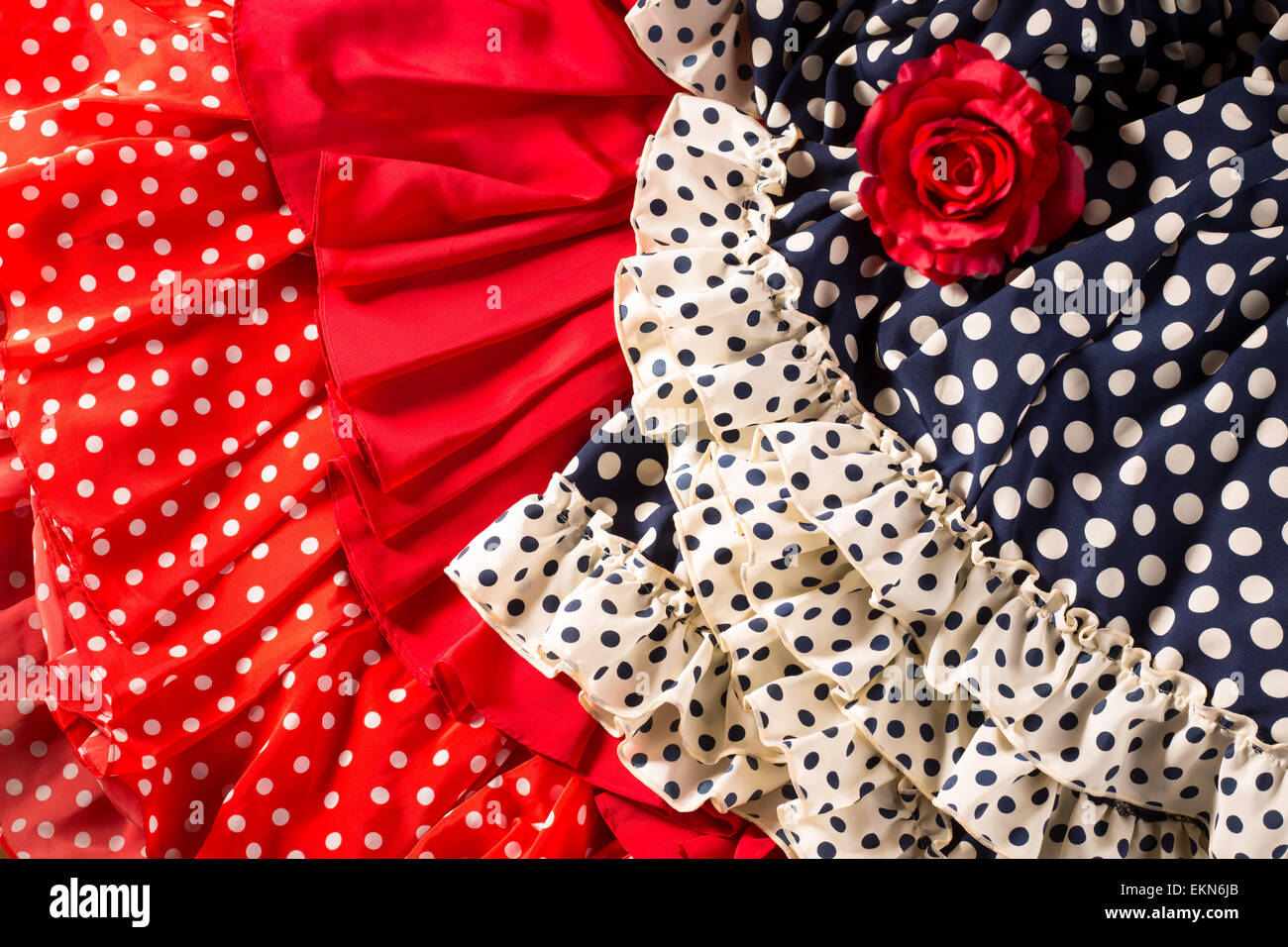 Flamenco dresses in red blue with spot and red rose Stock Photo - Alamy