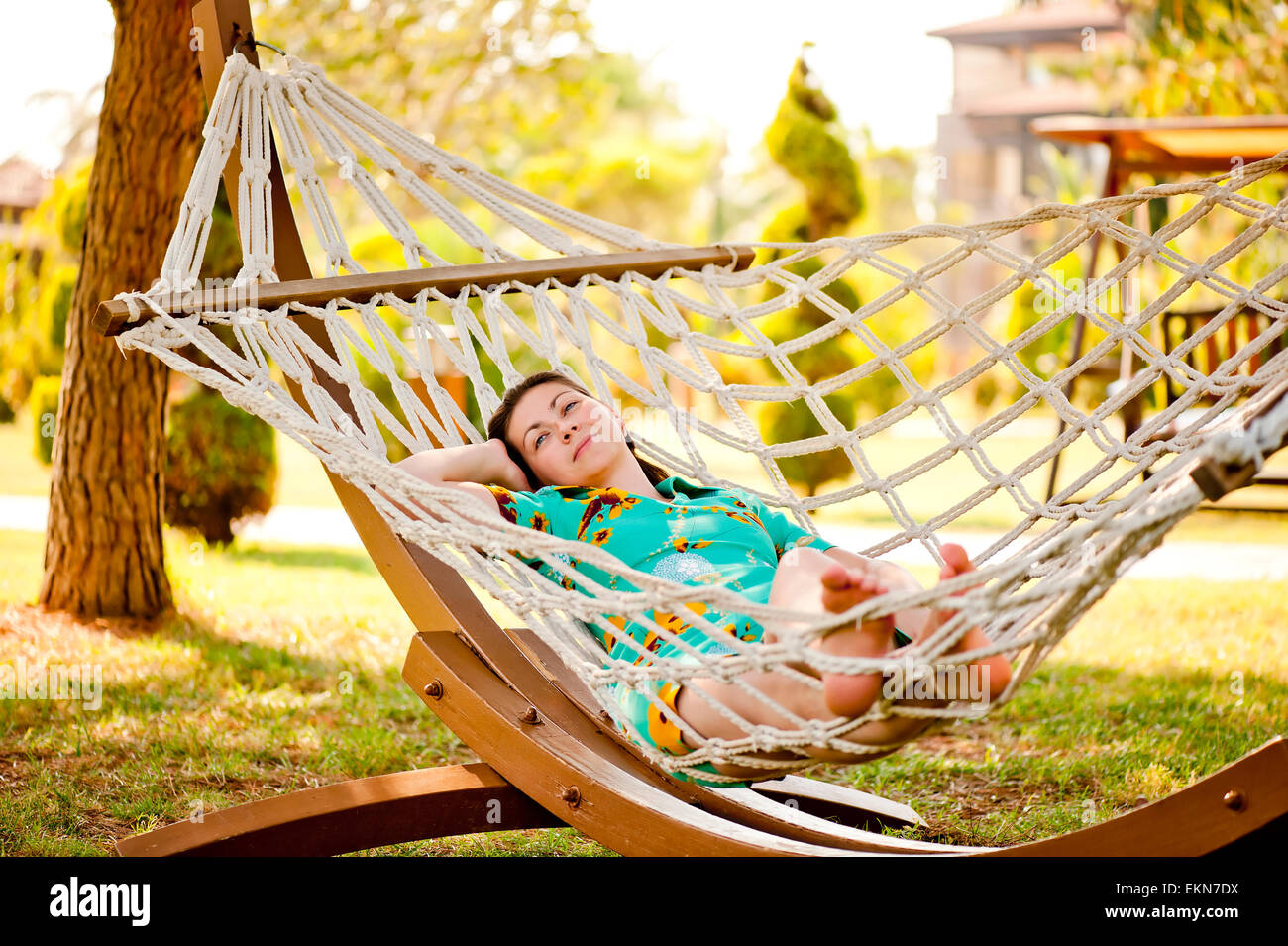 Tourist sunbathing on hammock hi-res stock photography and images - Alamy