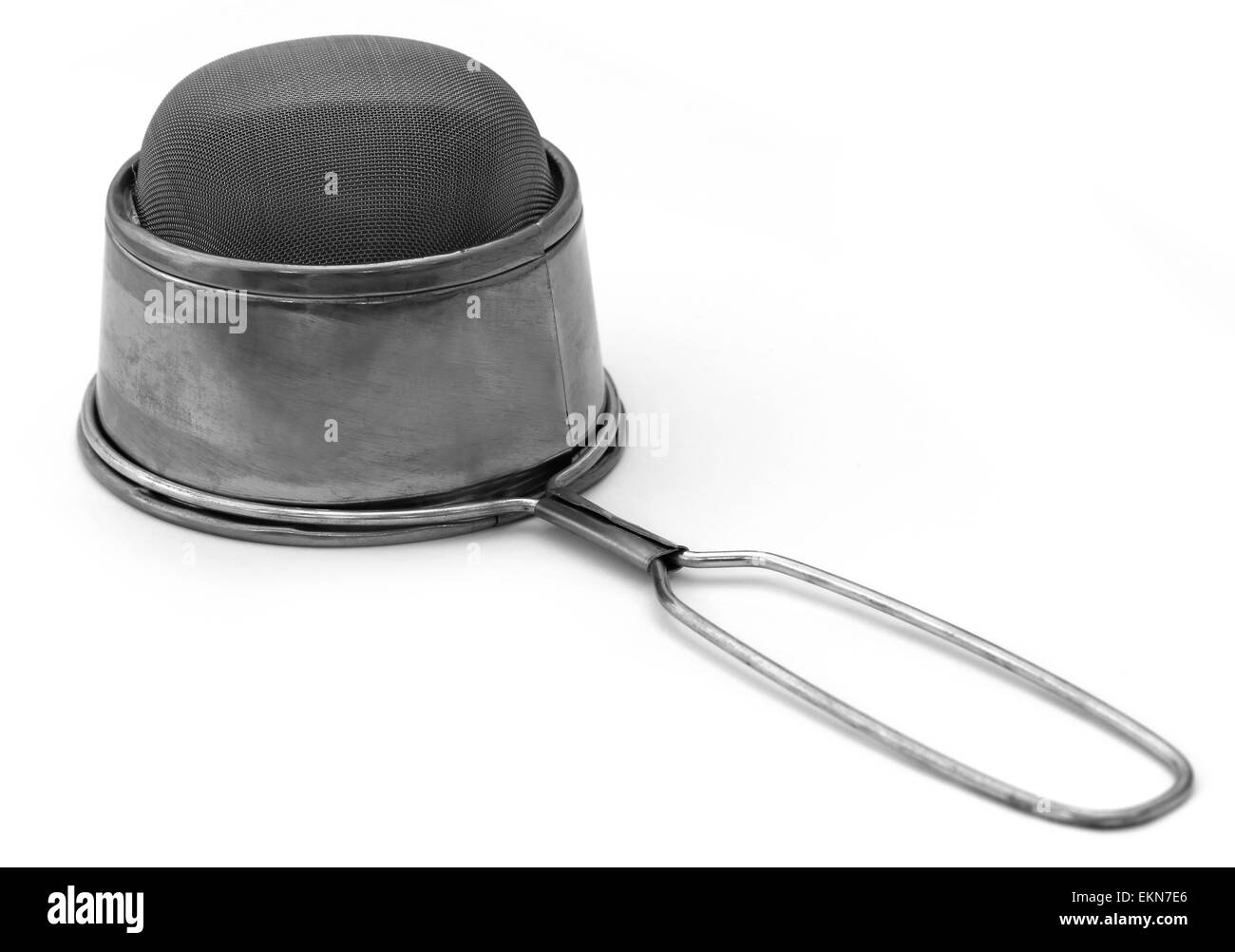 Steel made tea stainer oer white background Stock Photo - Alamy