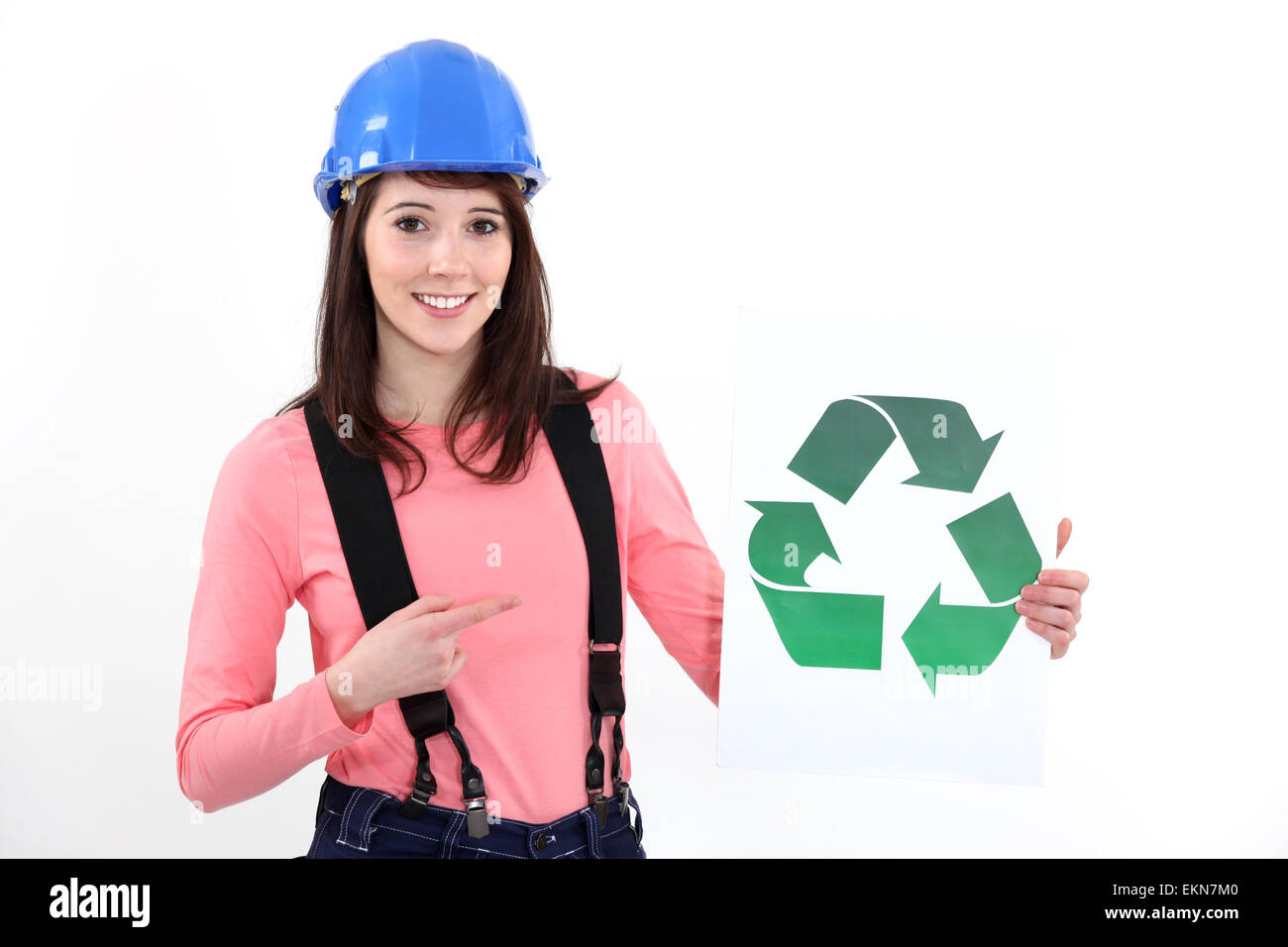 Craftswoman showing recycling logo Stock Photo - Alamy