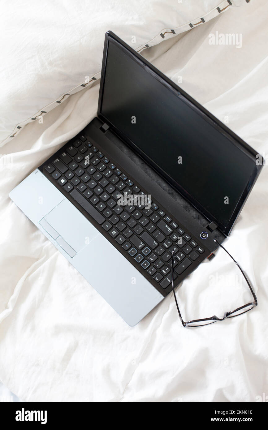 Laptop left on bed hi-res stock photography and images - Alamy