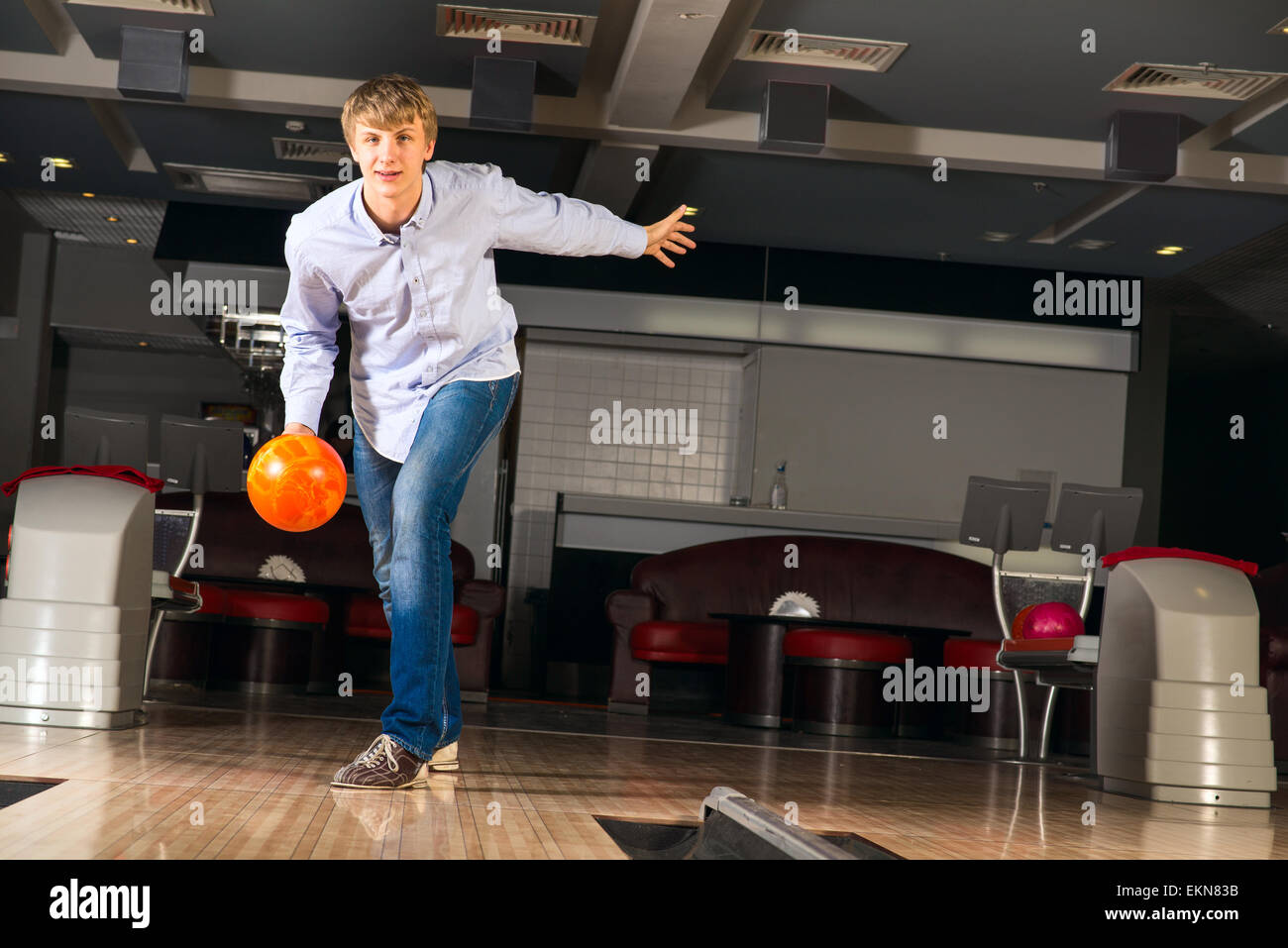 young man playing bowling Stock Photo - Alamy