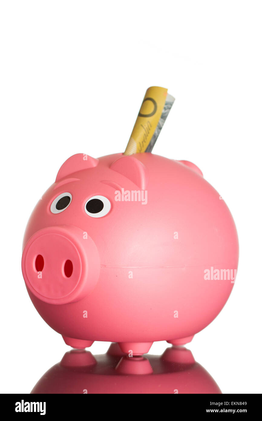 Pink piggy bank with australian dollars Stock Photo - Alamy