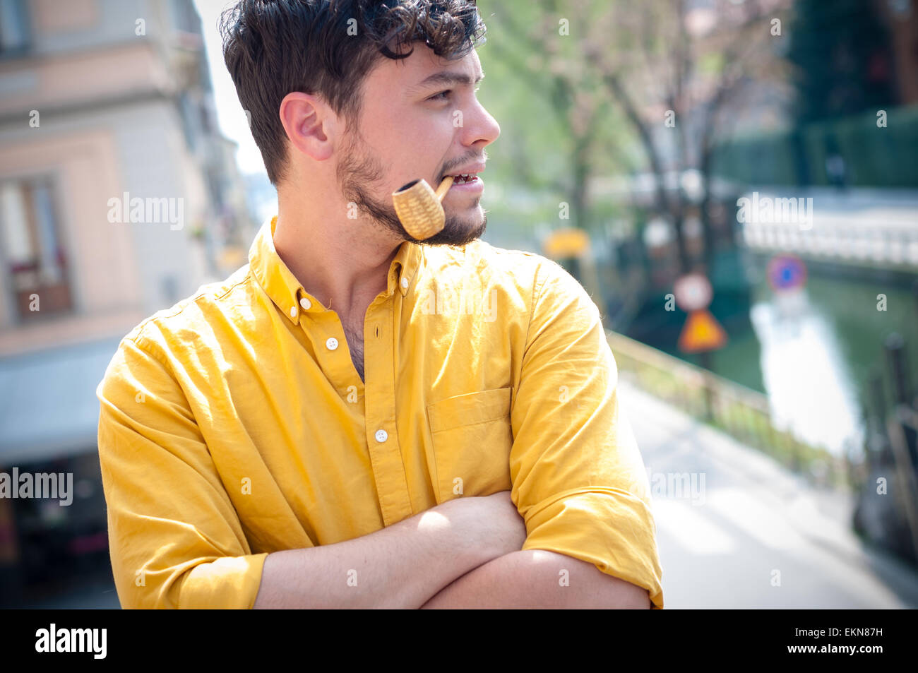 young man smoking pipe Stock Photo - Alamy