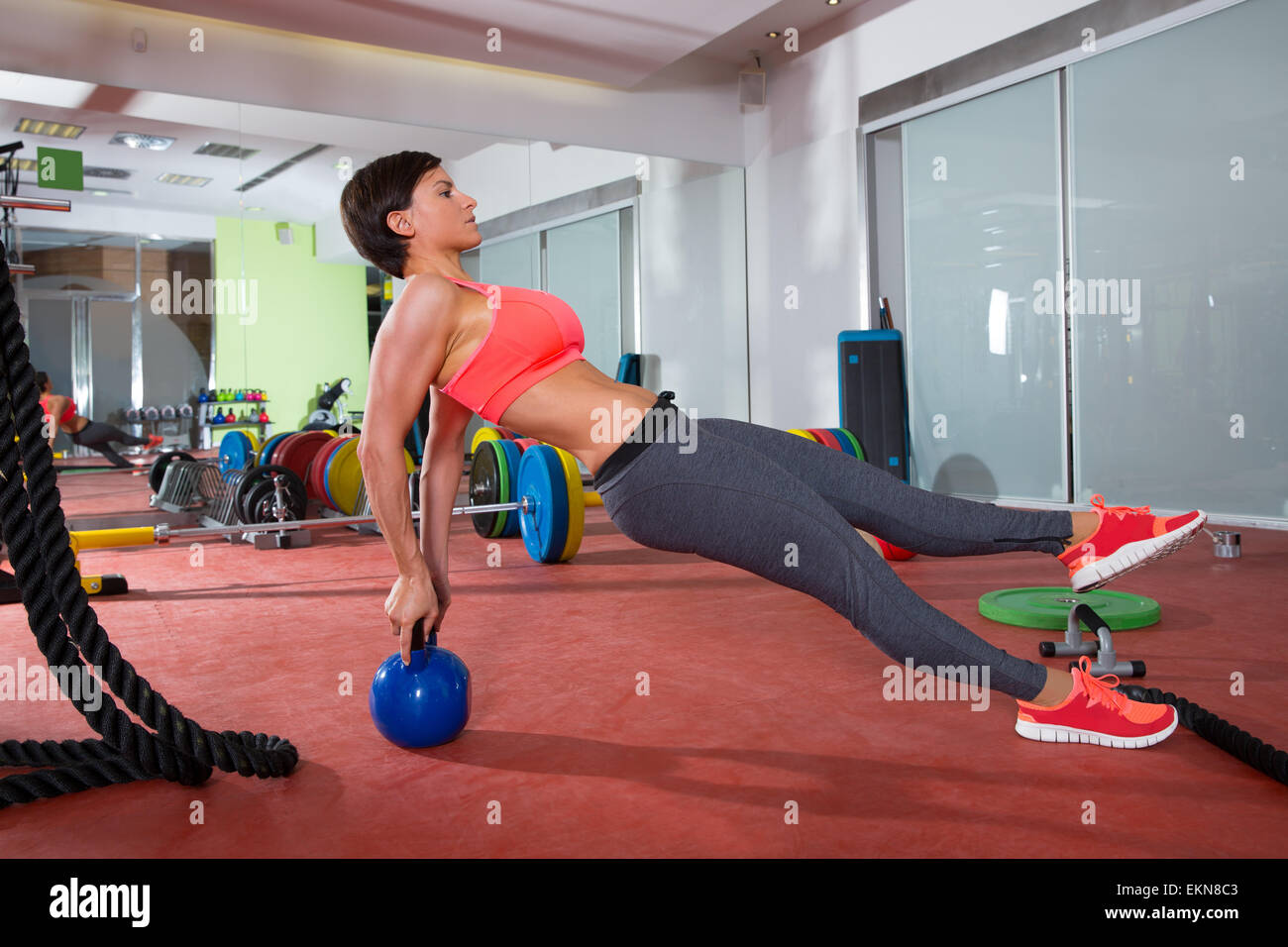 Crossfit fitness woman push ups kettlebell pushup exercise Stock Photo ...