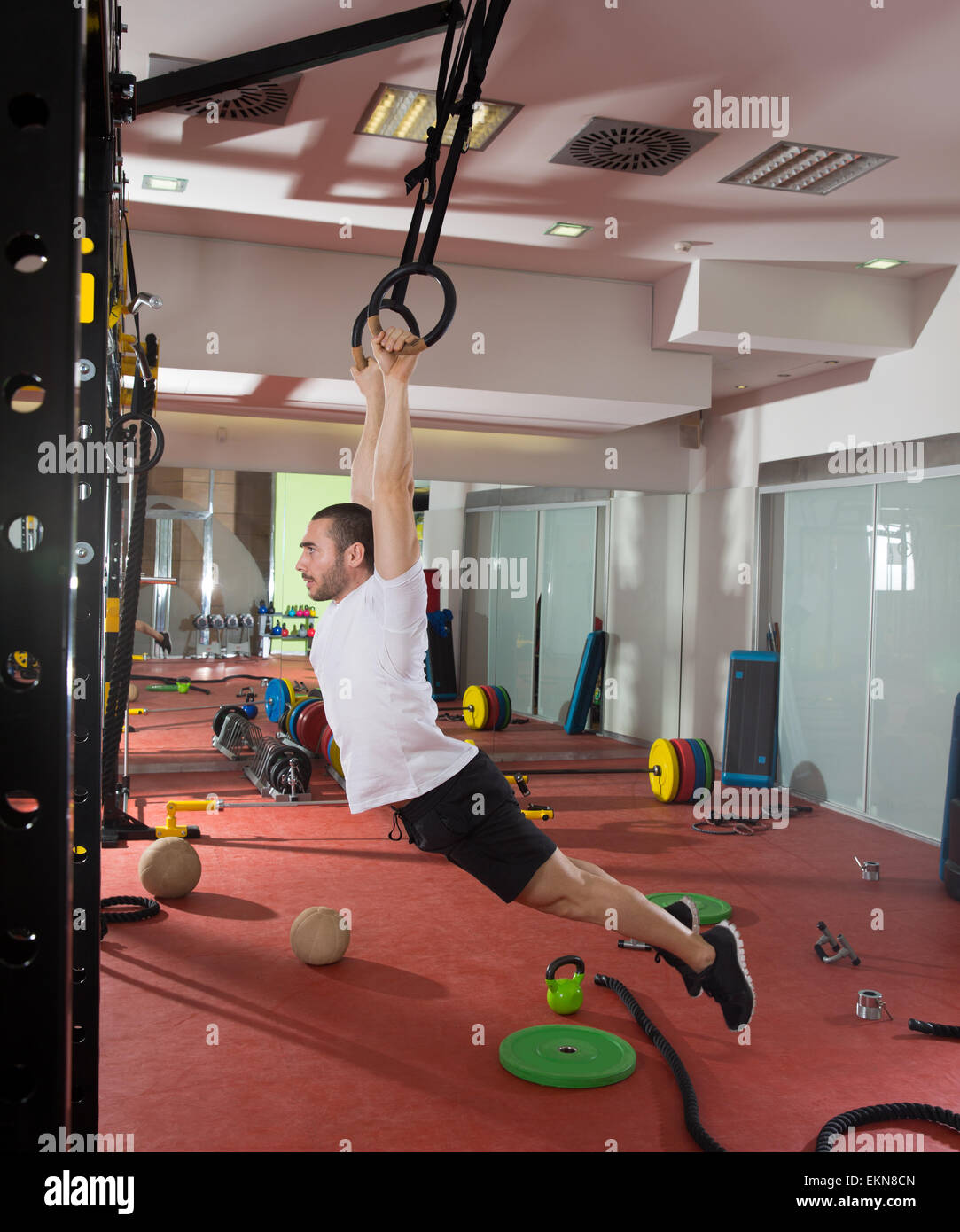 Crossfit fitness dip ring swing exercise man workout Stock Photo - Alamy