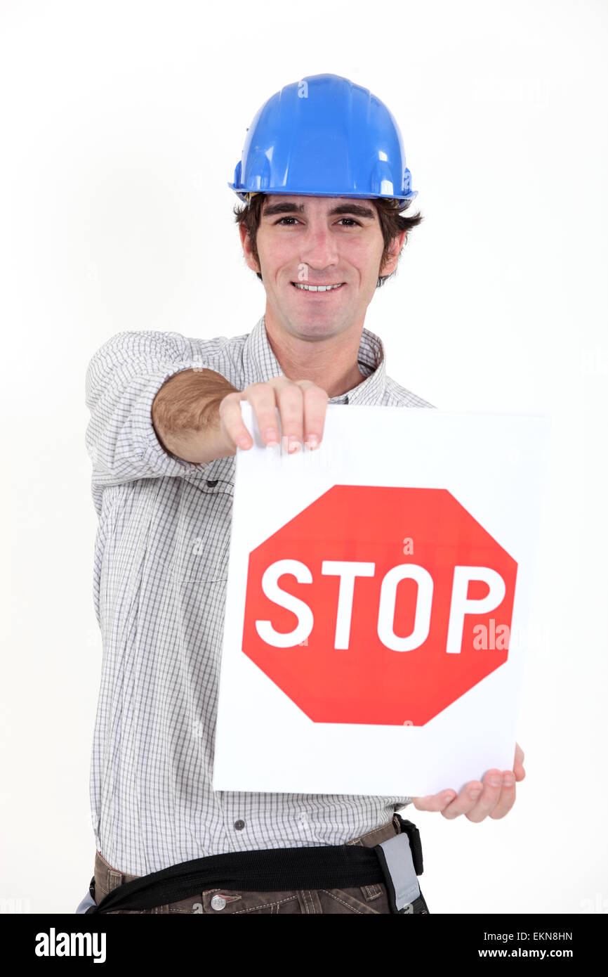 Construction worker with a stop sign Stock Photo - Alamy