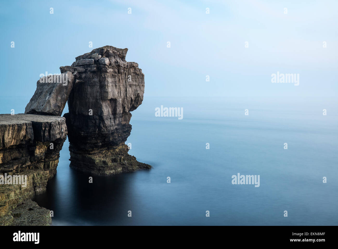 Rocky cliff landscape with sunset over ocean Stock Photo - Alamy