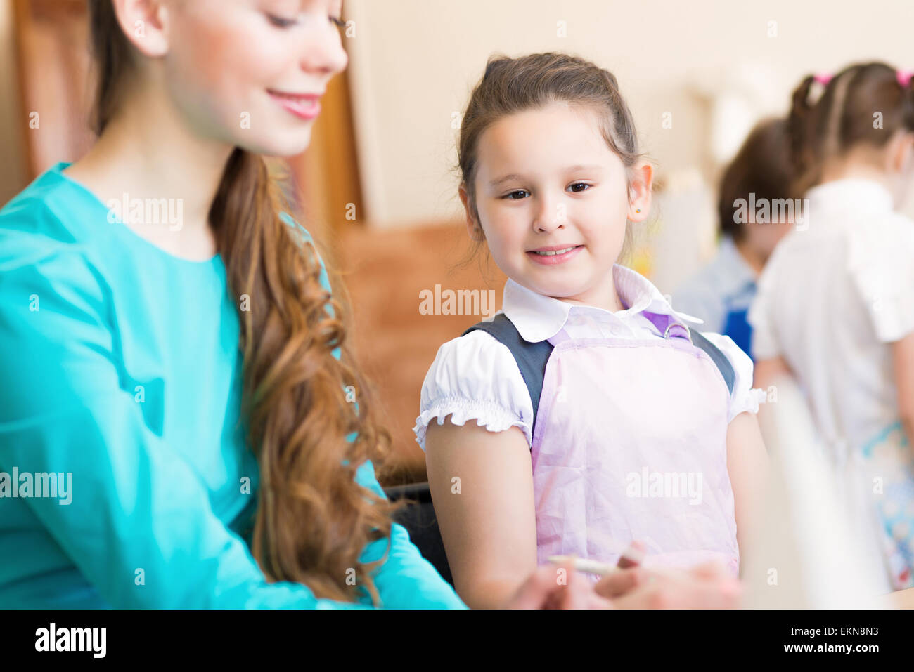 Children helping each other classroom hi-res stock photography and ...
