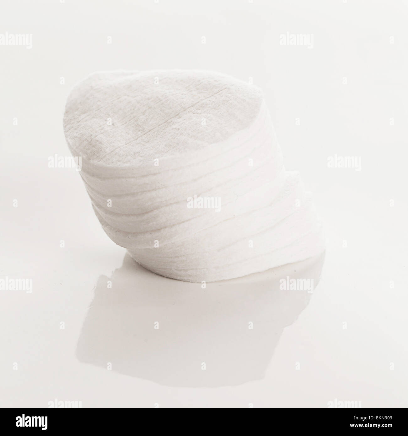 White cotton pads on a white background Stock Photo - Alamy