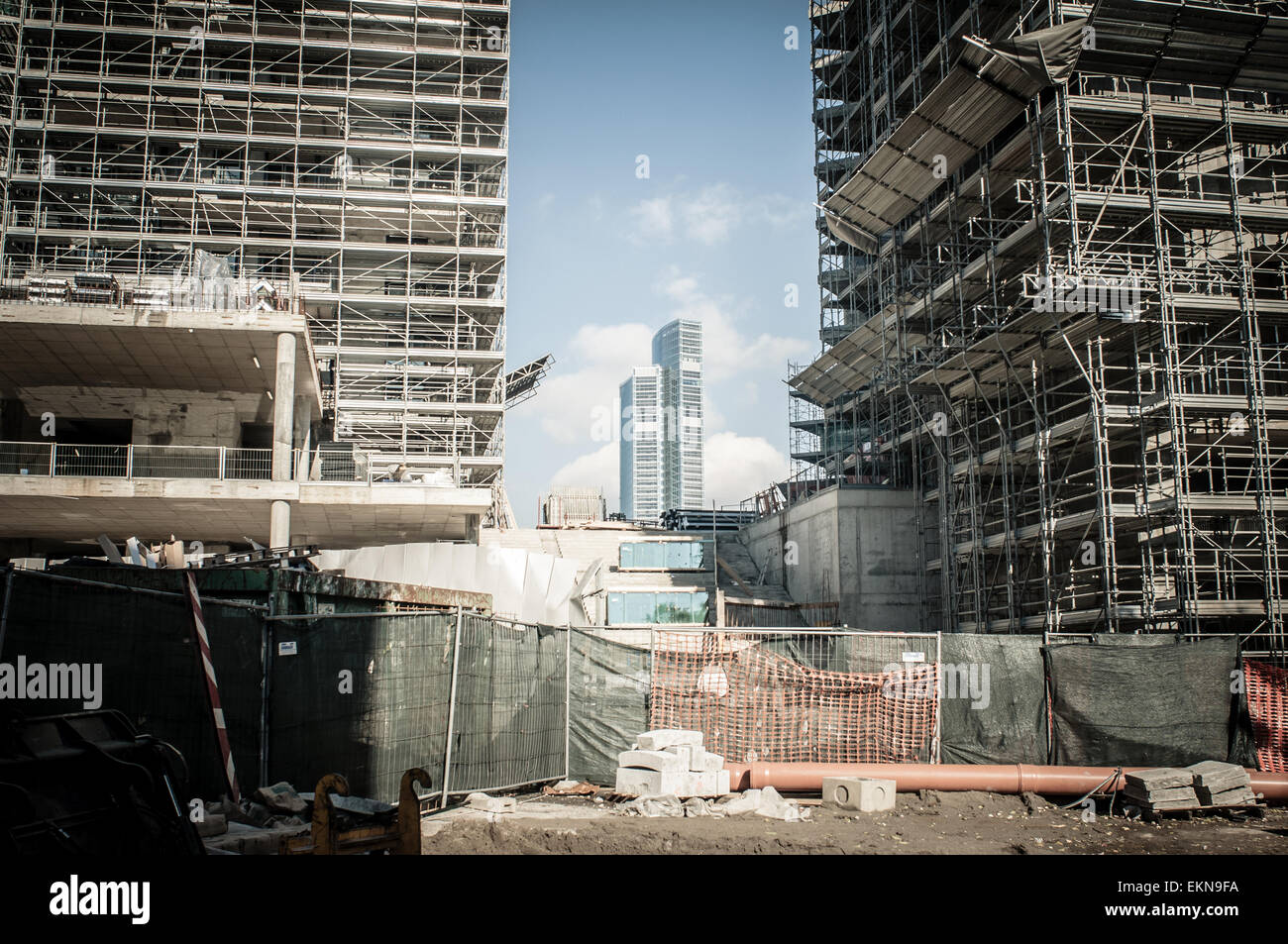 business building between buildings under construction Stock Photo - Alamy