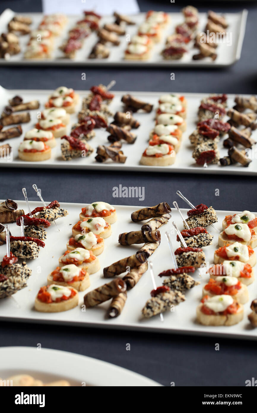 Small gourmet snacks on a plate Stock Photo - Alamy
