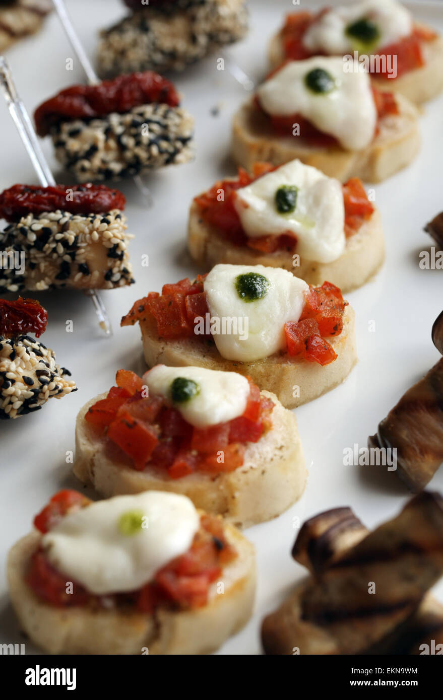 Small gourmet snacks on a plate Stock Photo - Alamy