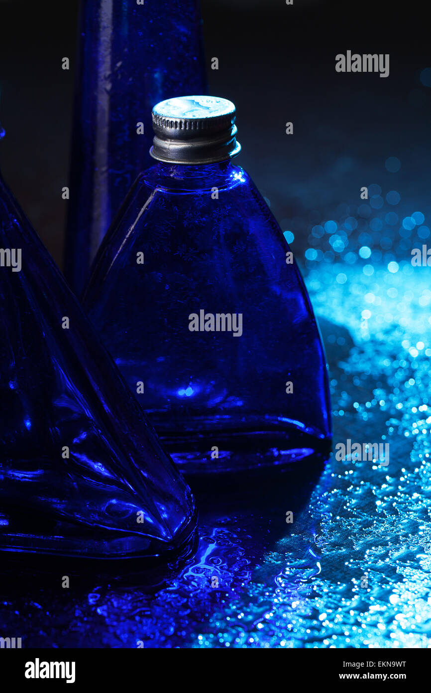 Little blue bottles on a background Stock Photo - Alamy