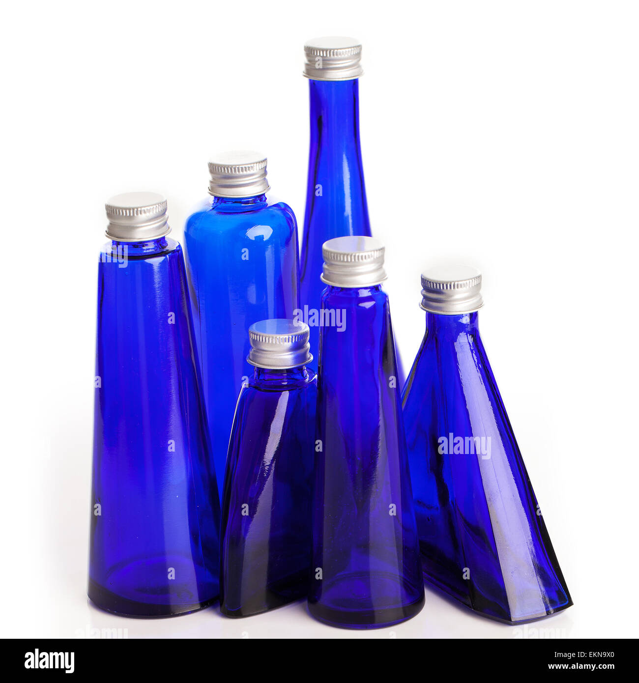 Little blue bottles isolated Stock Photo - Alamy