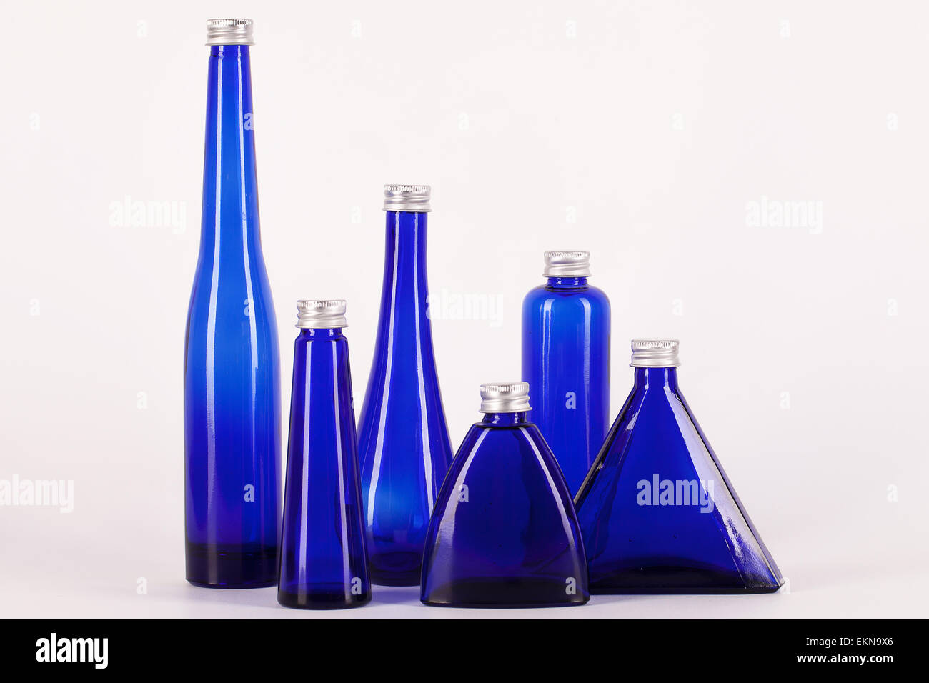 Little blue bottles isolated Stock Photo - Alamy