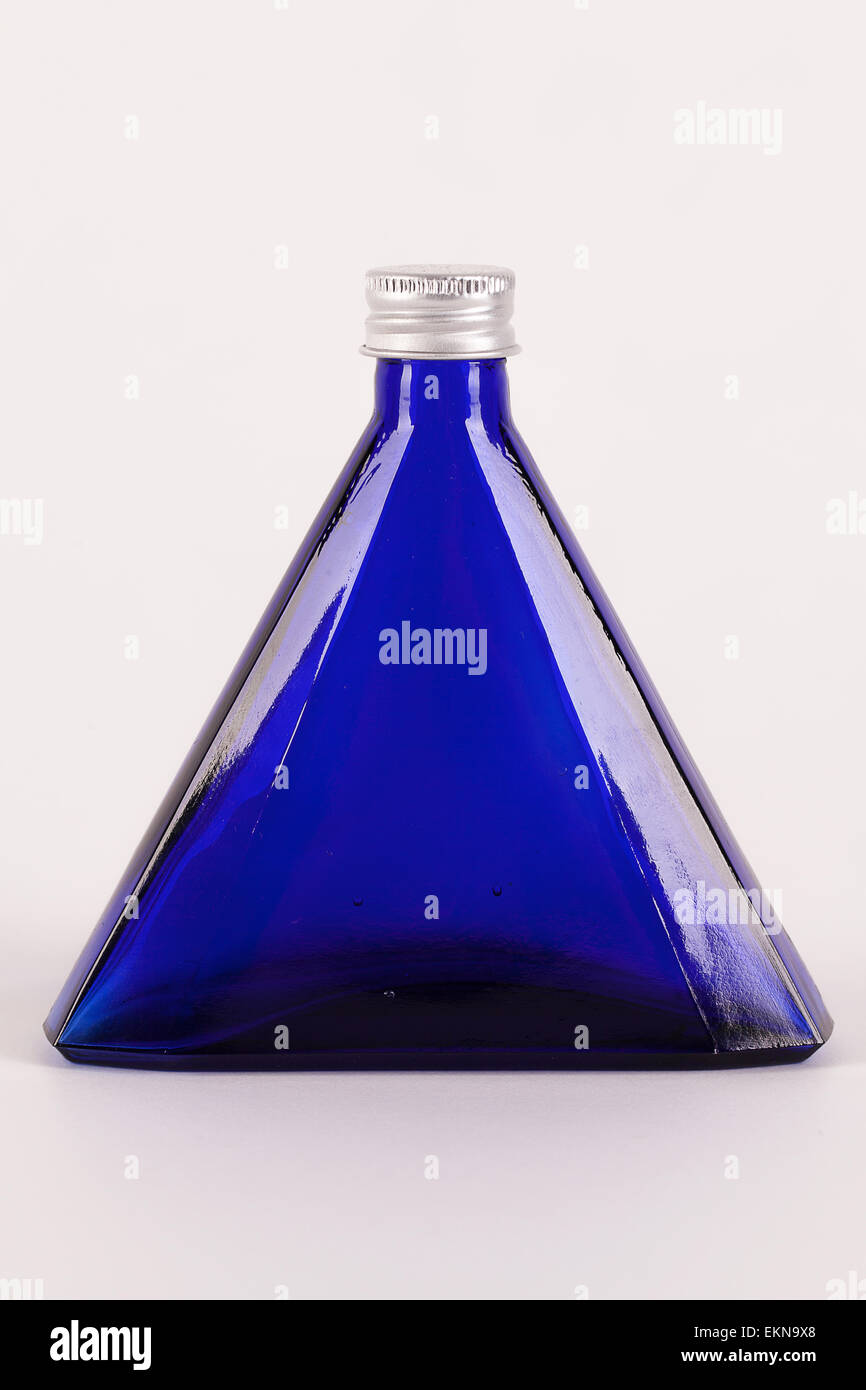 Little blue bottle isolated Stock Photo - Alamy
