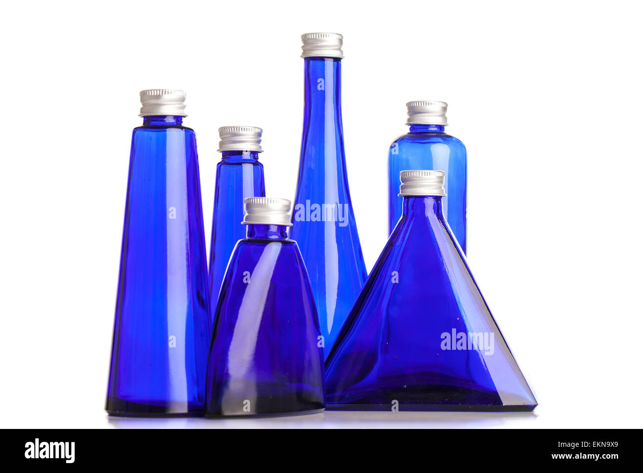 Little blue bottles isolated Stock Photo - Alamy
