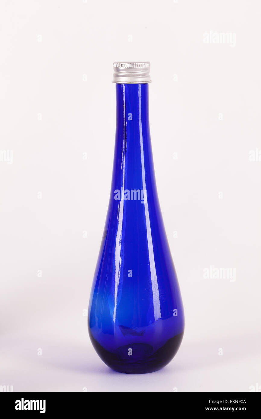 Little blue bottle isolated Stock Photo - Alamy
