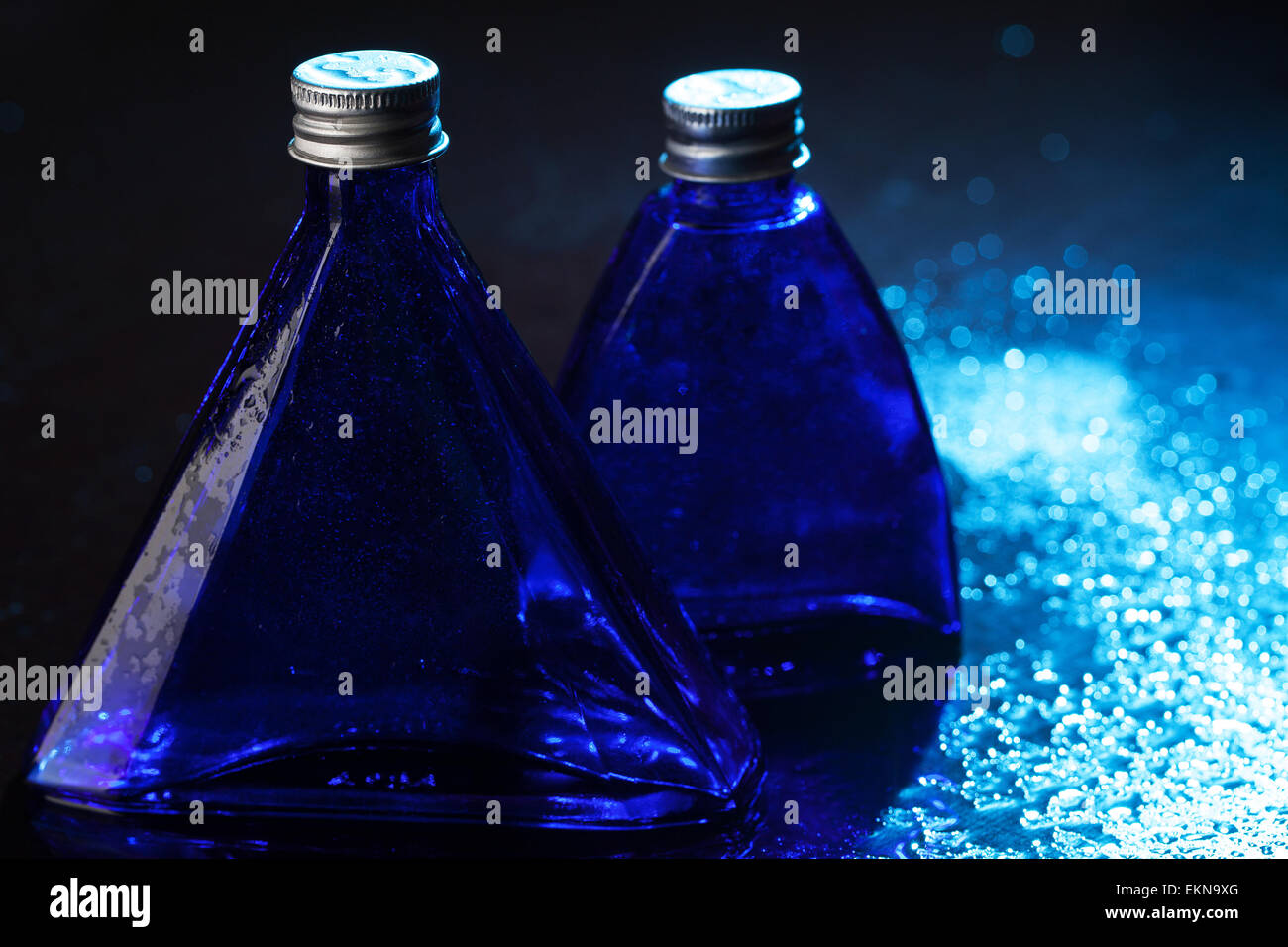 Little blue bottles on a background Stock Photo - Alamy