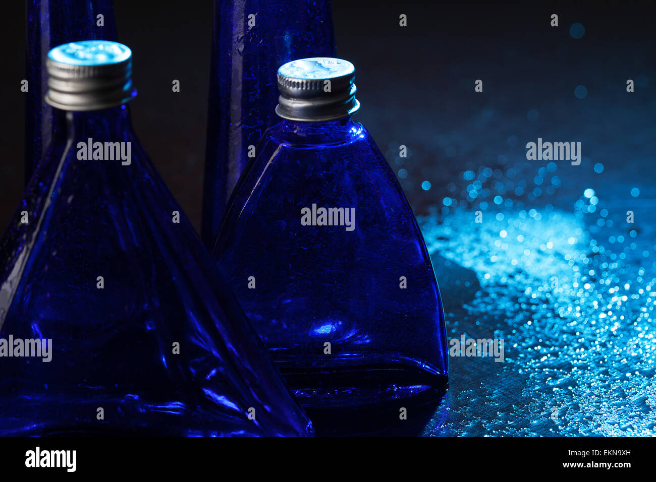 Little blue bottles on a background Stock Photo - Alamy